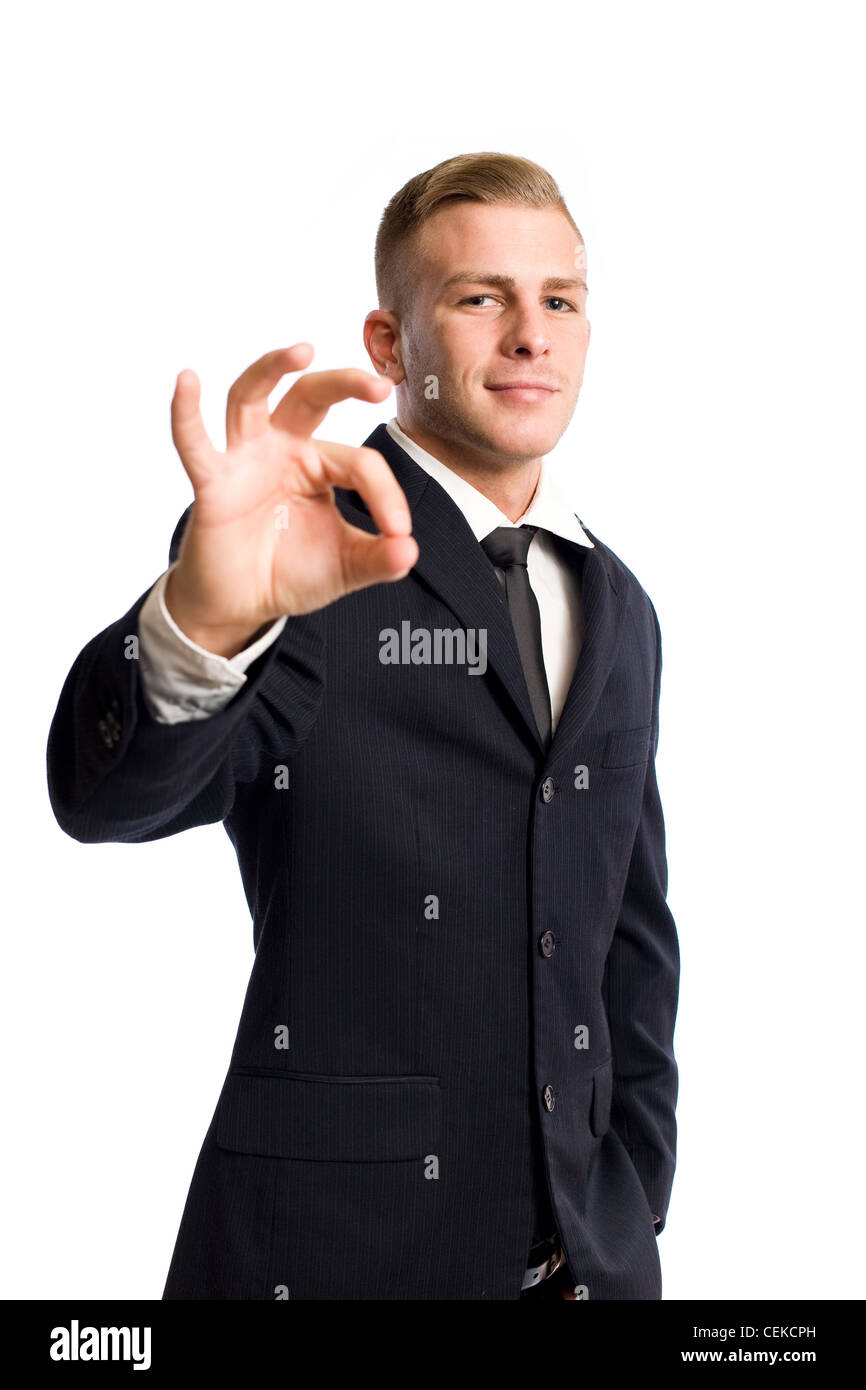 Portrait of a young businessman gesturing an OK sign Stock Photo - Alamy