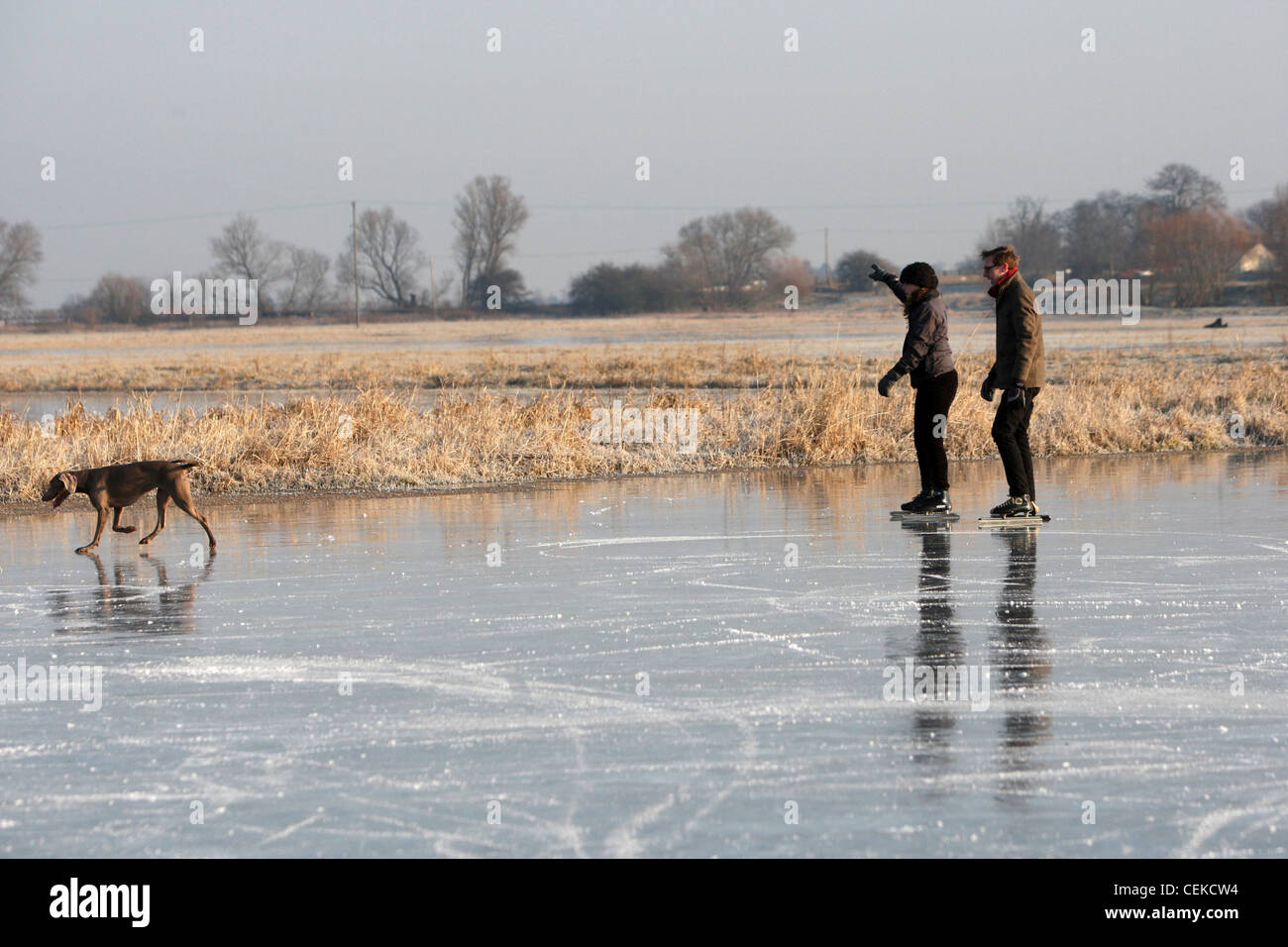 PEOPLE SKATING ON THE FROZEN FENS AT SUTTON GAULT,CAMBRIDGESHIRE Stock ...