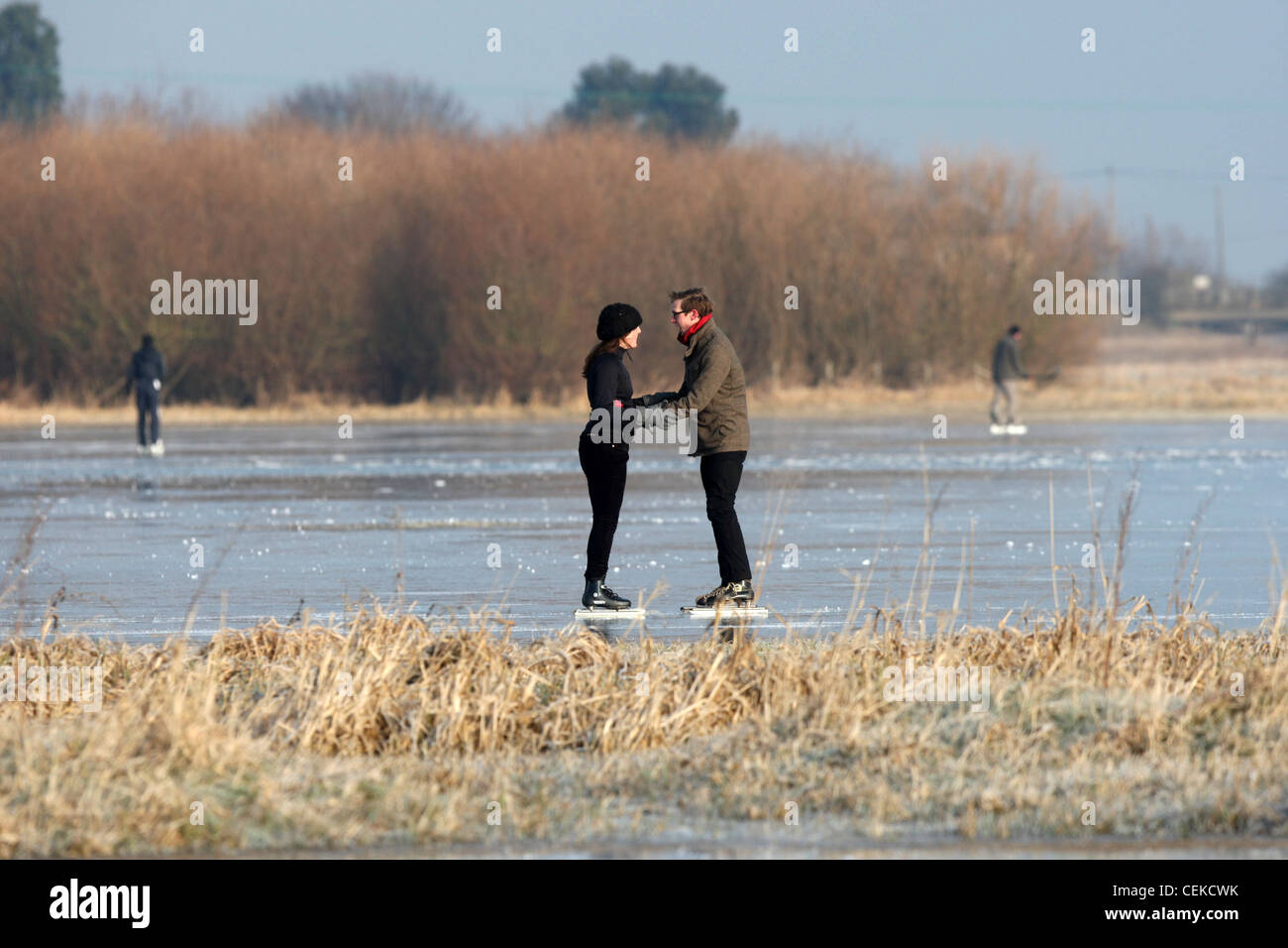 PEOPLE SKATING ON THE FROZEN FENS AT SUTTON GAULT,CAMBRIDGESHIRE Stock ...