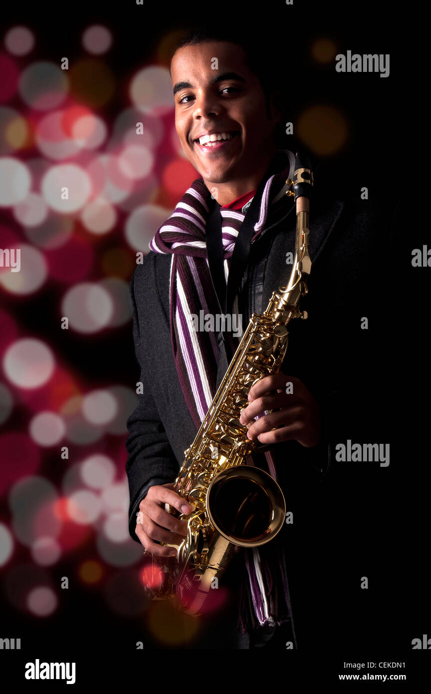 Stylish man playing the saxophone Stock Photo - Alamy