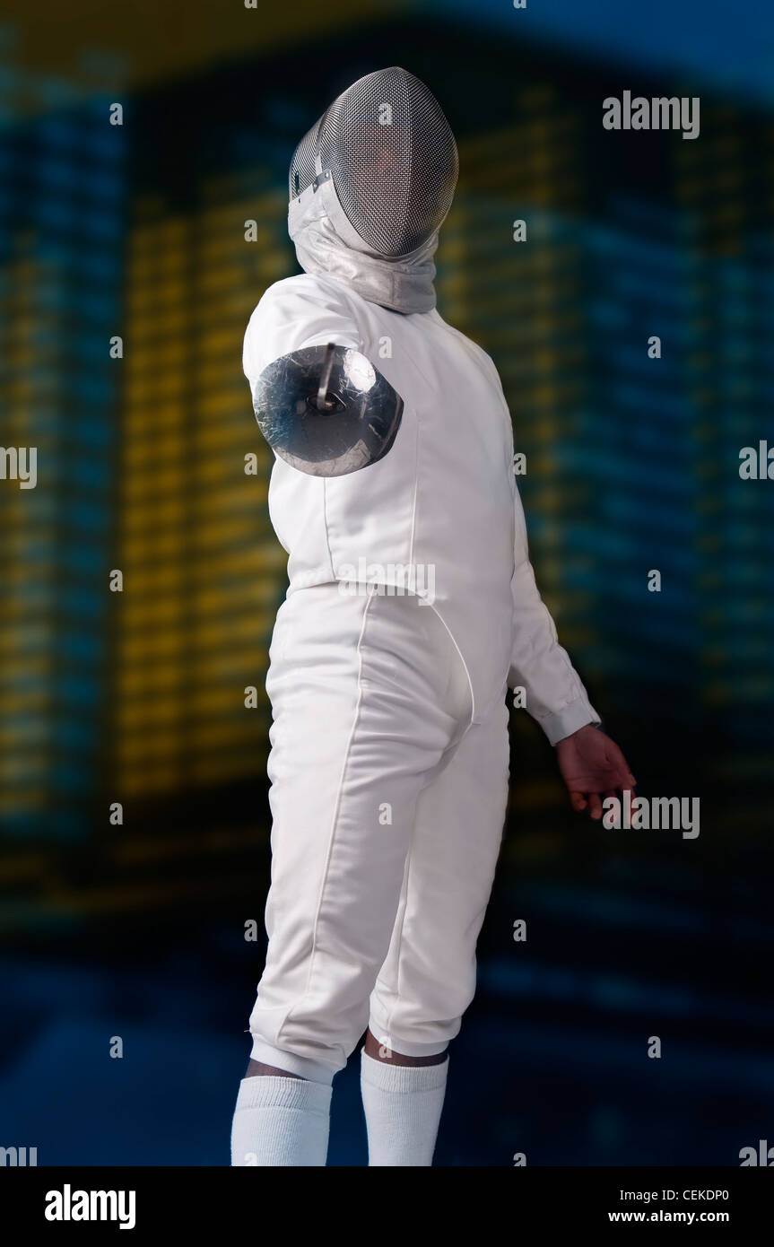 Male fencer isolated in a dark background Stock Photo - Alamy