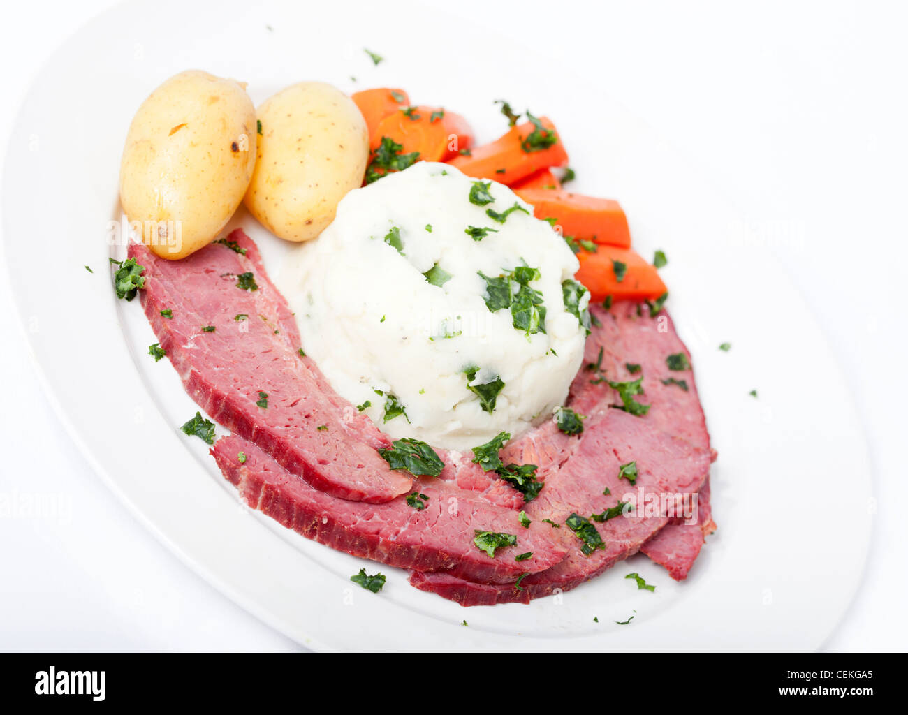 Traditional Corned Beef Dinner isolated on white Stock Photo - Alamy