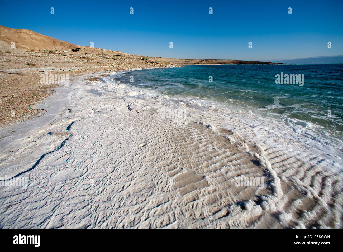 Middle East, Israel, Dead Sea salt on coast and in water Stock Photo ...