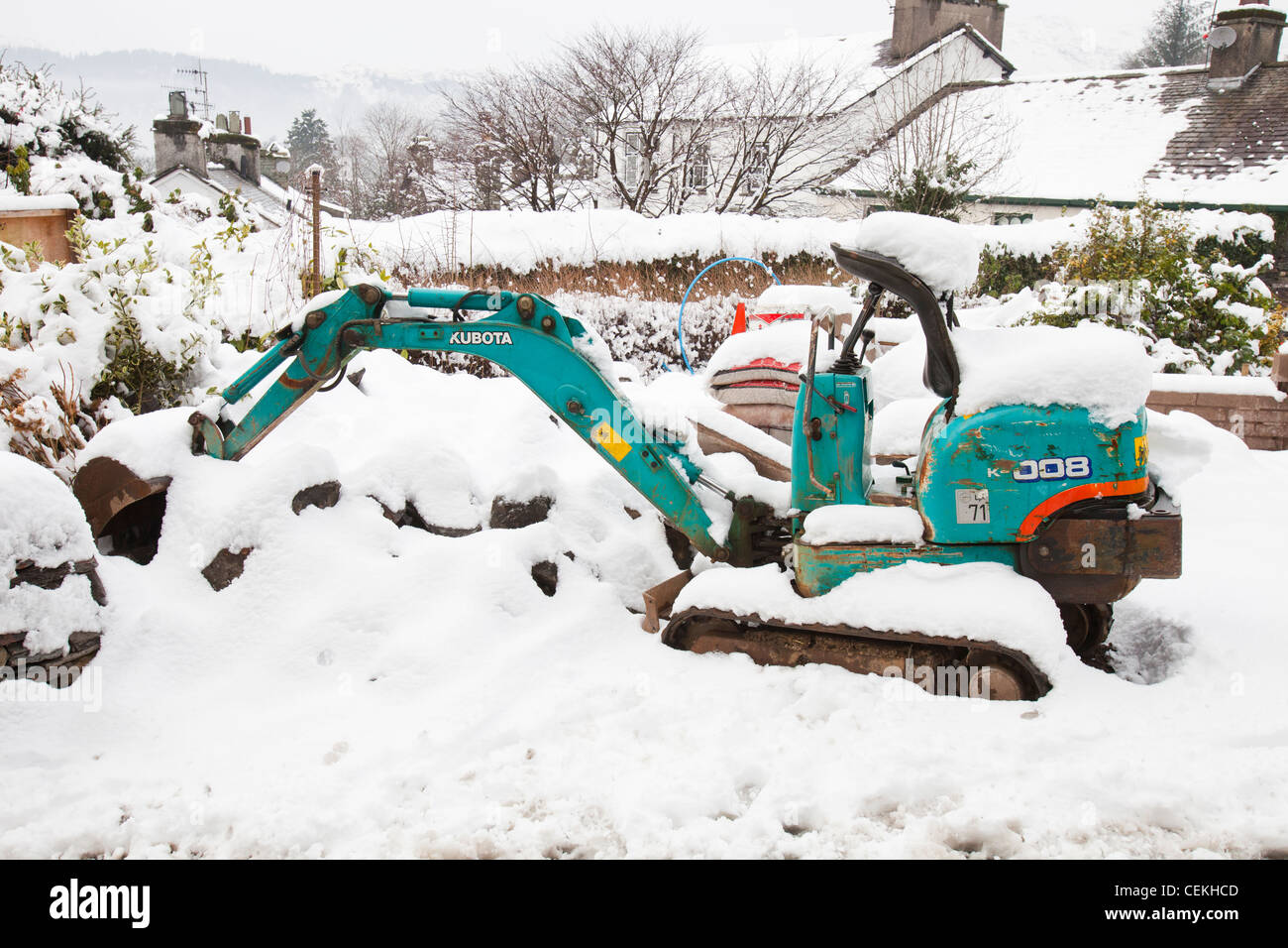 Small digger in snow hi-res stock photography and images - Alamy