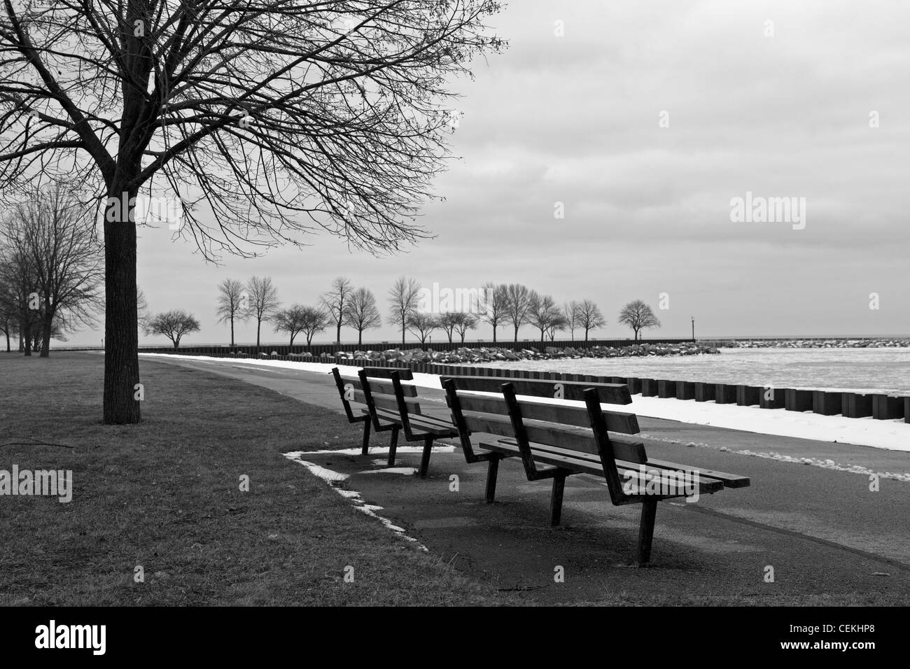 Empty benches at Milwaukee's lakefront add a somber note to an overcast ...