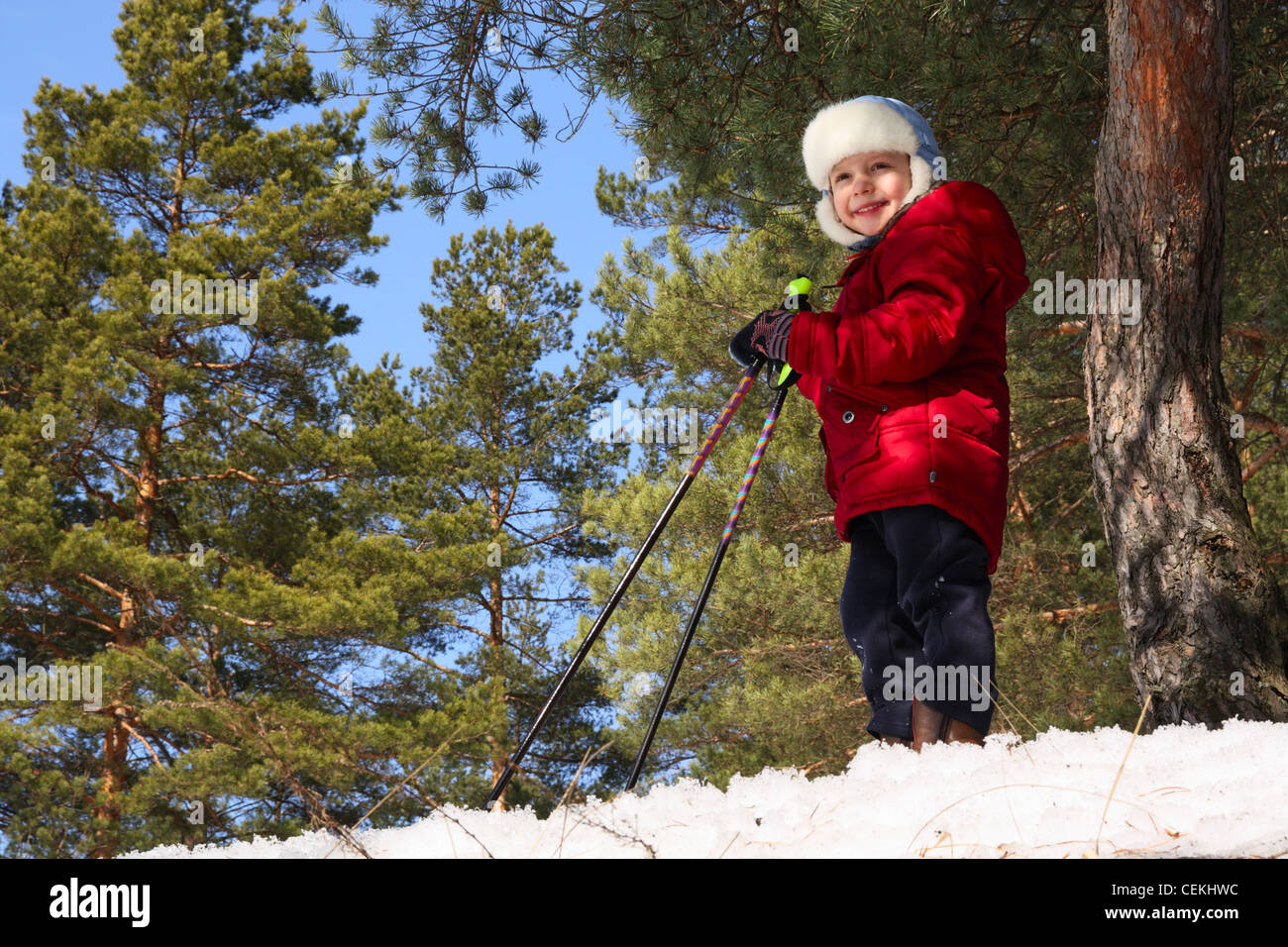 The smiling small skier on a hill Stock Photo - Alamy
