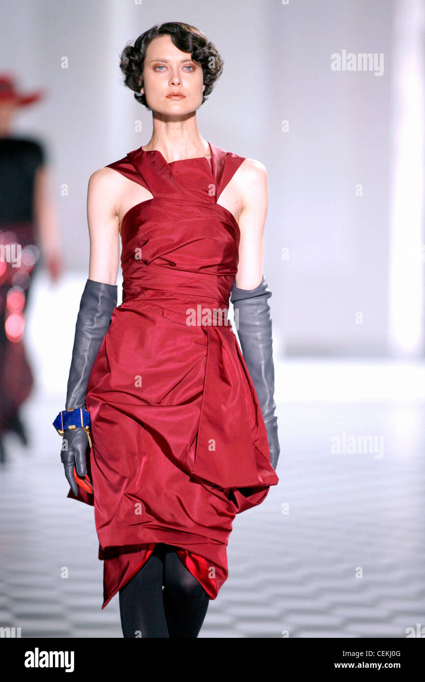 Model Shalom Harlow brunette hair wearing crimson red halterneck silk ...