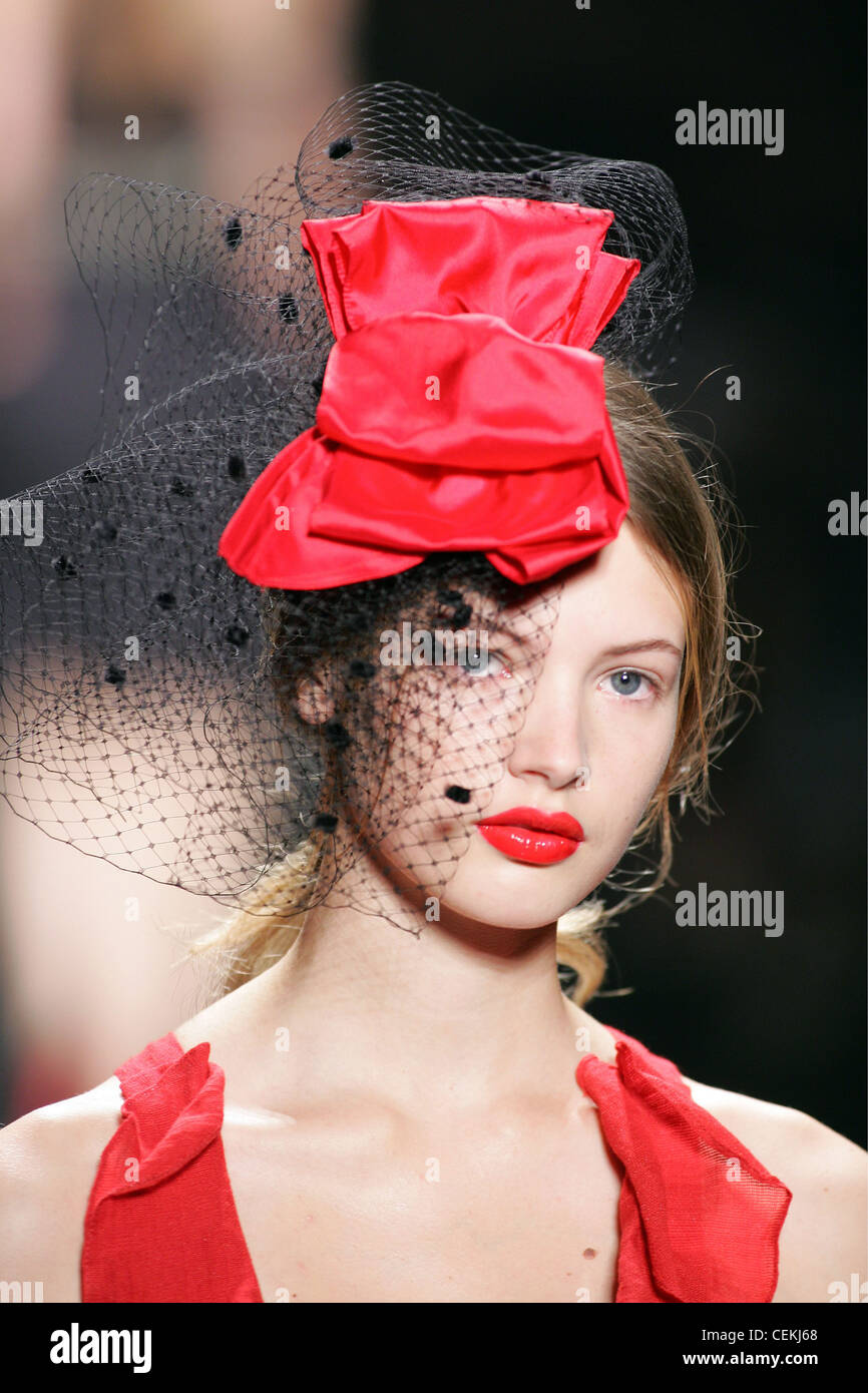 Sonia Rykiel Female model dark blonde hair swept back wearing a large ...