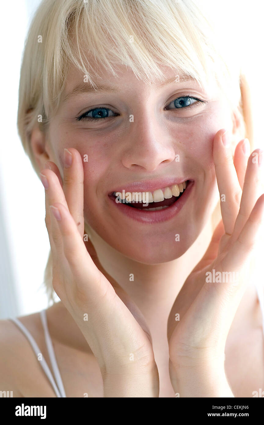 Fingers on cheeks hi-res stock photography and images - Alamy