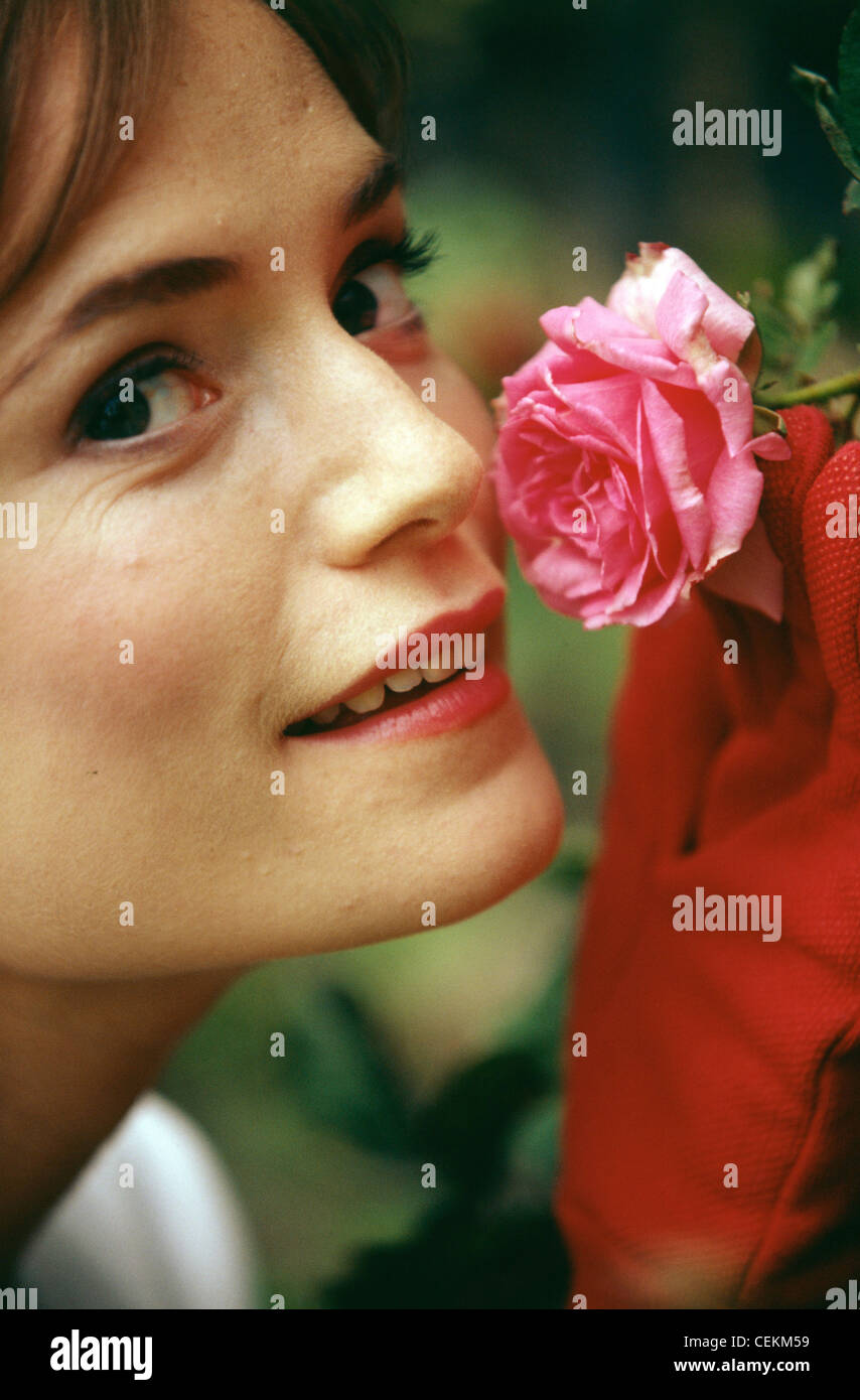 Female smelling a rose Stock Photo - Alamy