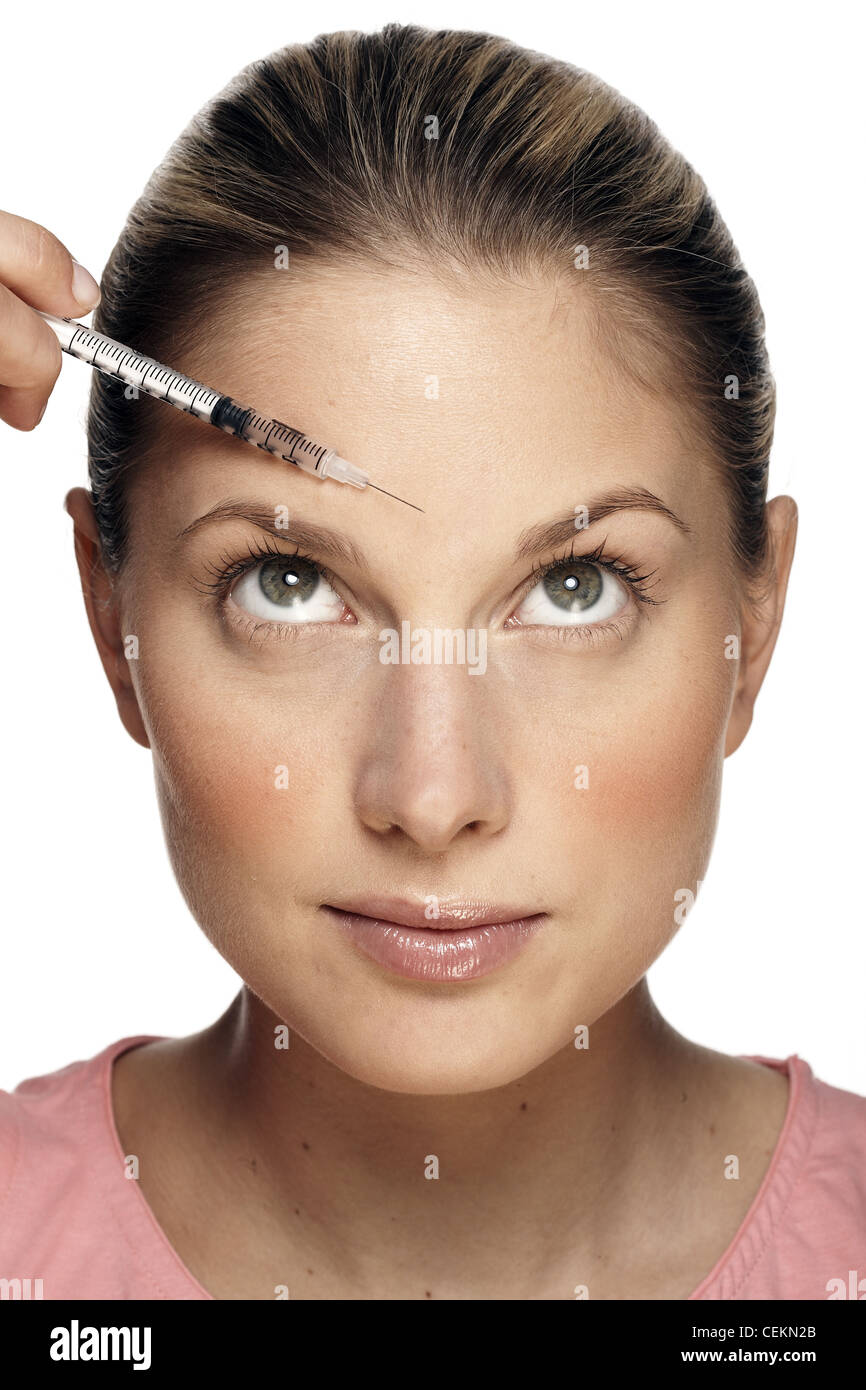 Female having botox injection on forehead Stock Photo - Alamy