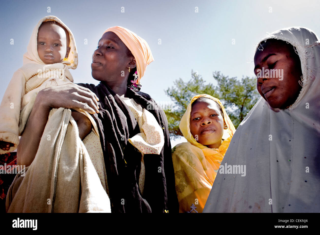 African women with a baby in her arms in Niamey, Niger Stock Photo - Alamy