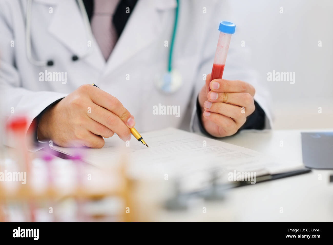 Doctor making blood analysis hi-res stock photography and images - Alamy