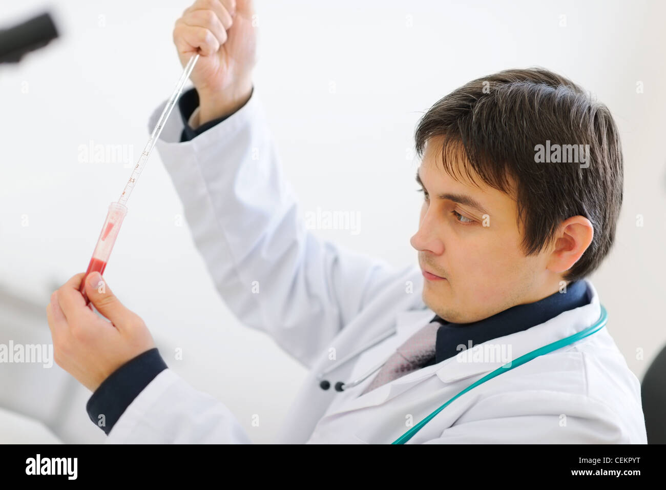 Medical doctor working with blood sample in laboratory Stock Photo - Alamy