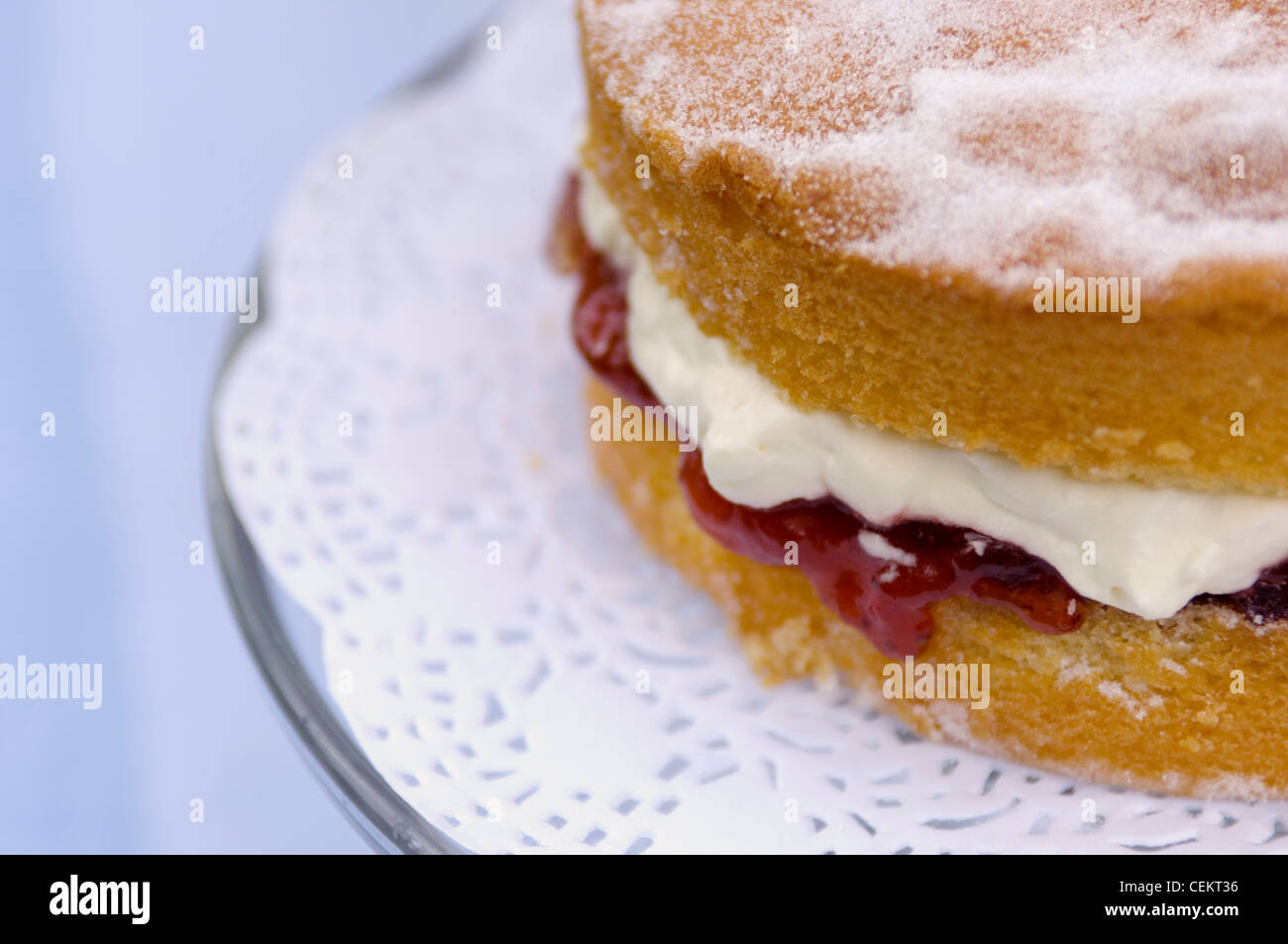 An English cream tea Victoria sponge cake with strawberry jam and cream ...