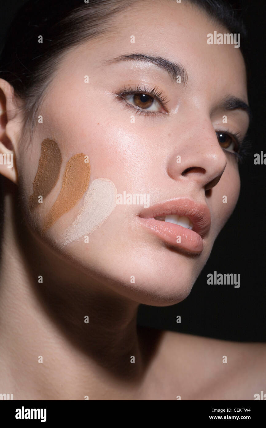 Female with three different shades of foundation on her cheek Stock ...