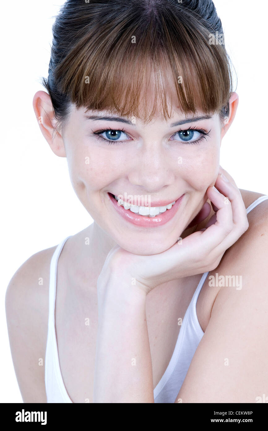 Female resting her chin on her hand Stock Photo - Alamy