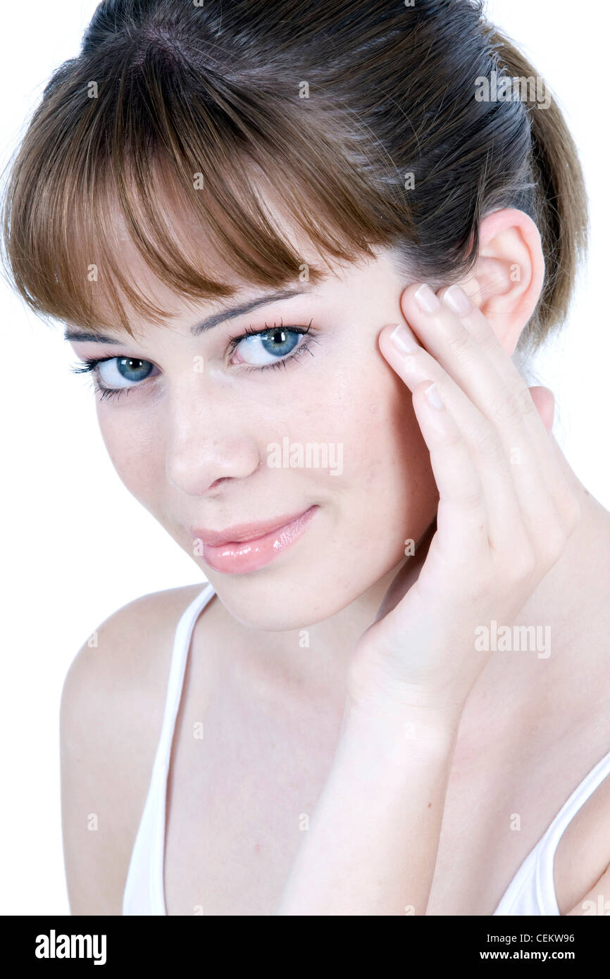 Female with her hand on the side of her face Stock Photo - Alamy
