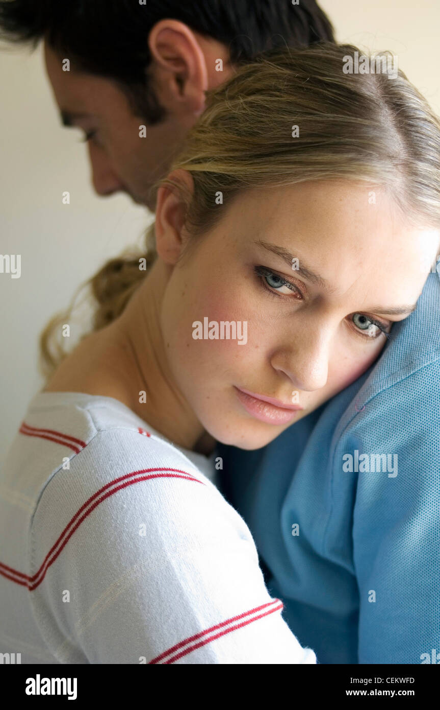 Female leaning head on males shoulder Stock Photo - Alamy