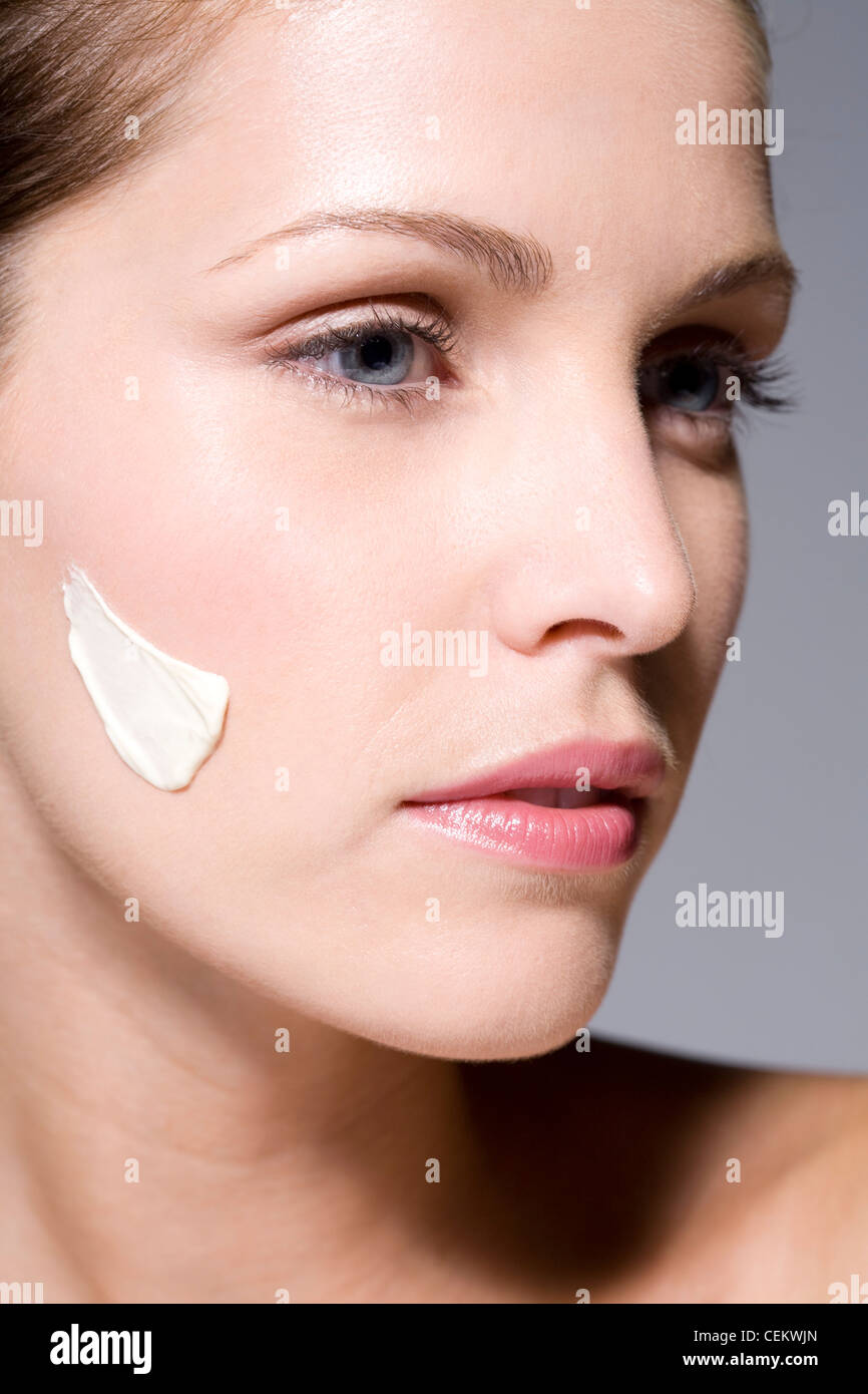 Female wearing natural make up, with a streak of foundation on her ...