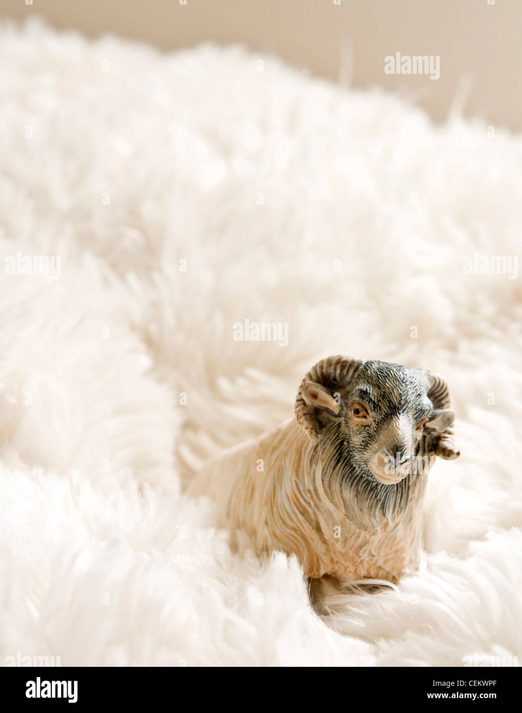 A still life of a plastic ram, in a white fluffy surface Stock Photo ...