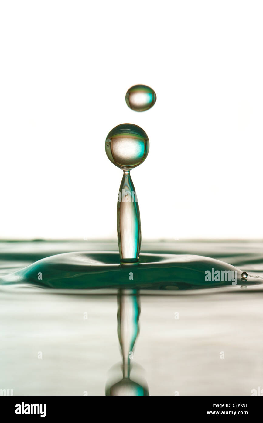 Water drop falling into the water Stock Photo - Alamy