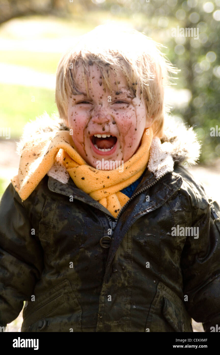 A male child with mud splattered over his face Stock Photo - Alamy