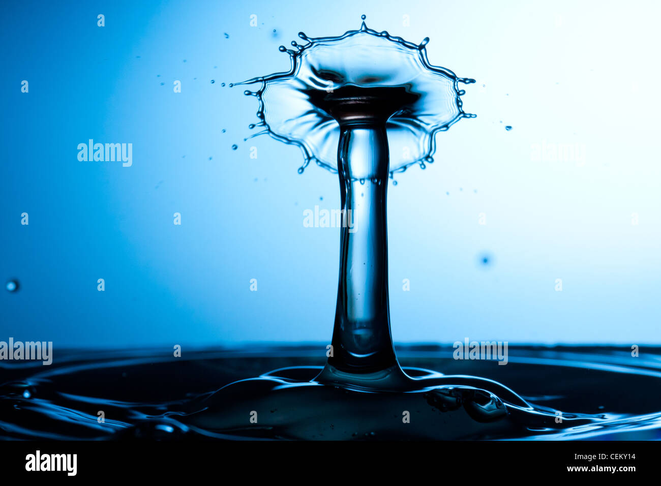 Water drop falling and colliding with another one Stock Photo - Alamy