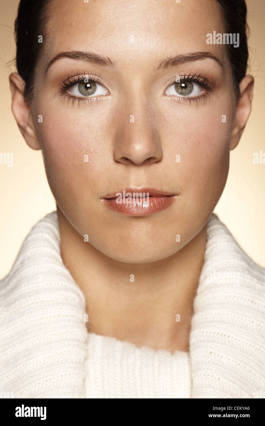 Female wearing a white roll neck jumper and natural style make up Stock ...