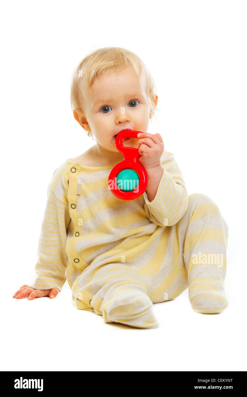 Lovely baby playing with rattle on floor isolated on white Stock Photo ...