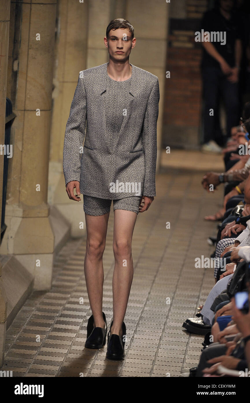Raf Simons Paris Menswear Spring Summer Model wearing short tight grey ...