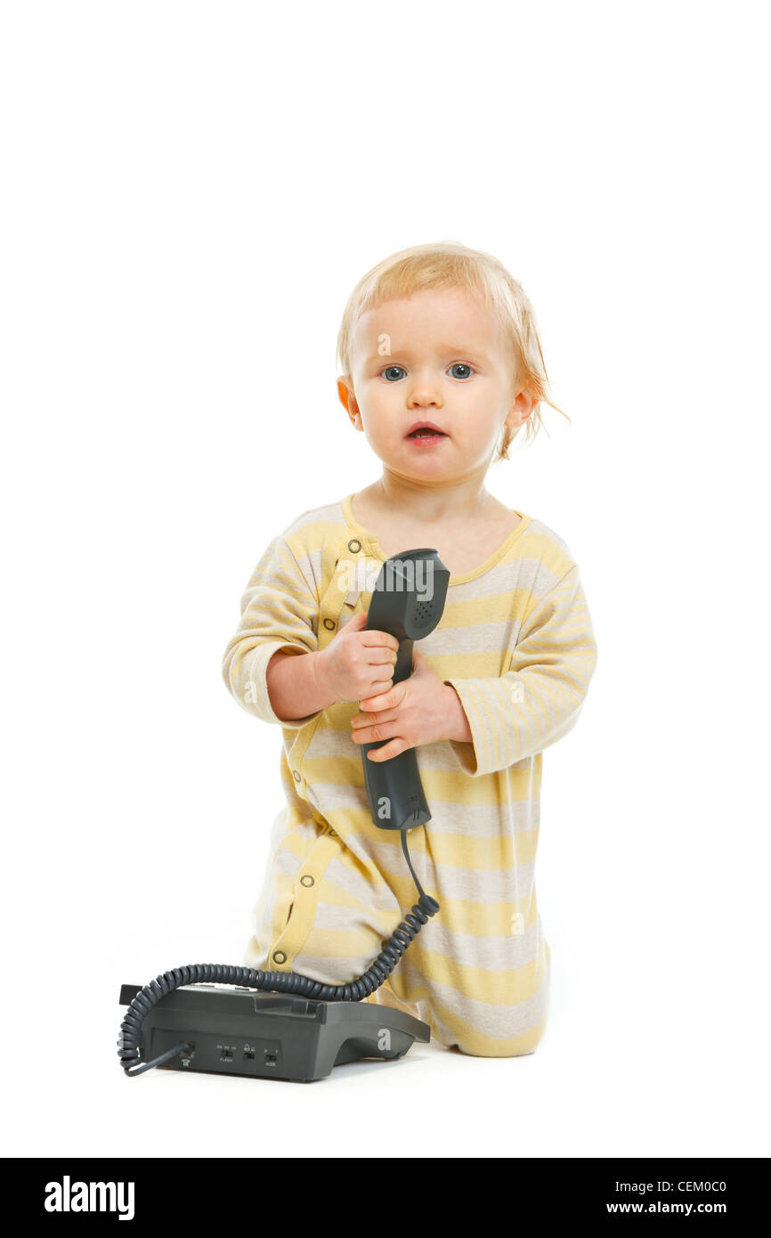 Adorable baby with phone handset isolated on white Stock Photo - Alamy