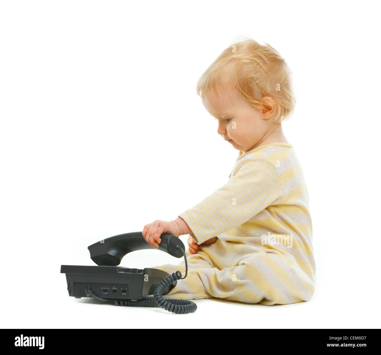 Cute baby playing with phone on white background Stock Photo - Alamy