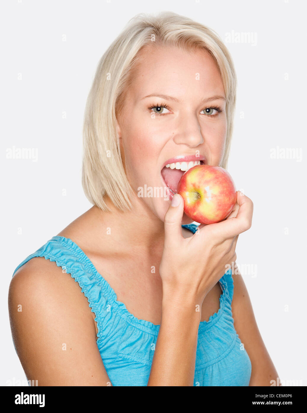 Female biting into an apple Stock Photo - Alamy