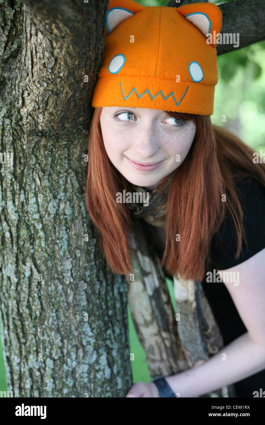 cute girl with freckles and animal hat smiling Stock Photo - Alamy