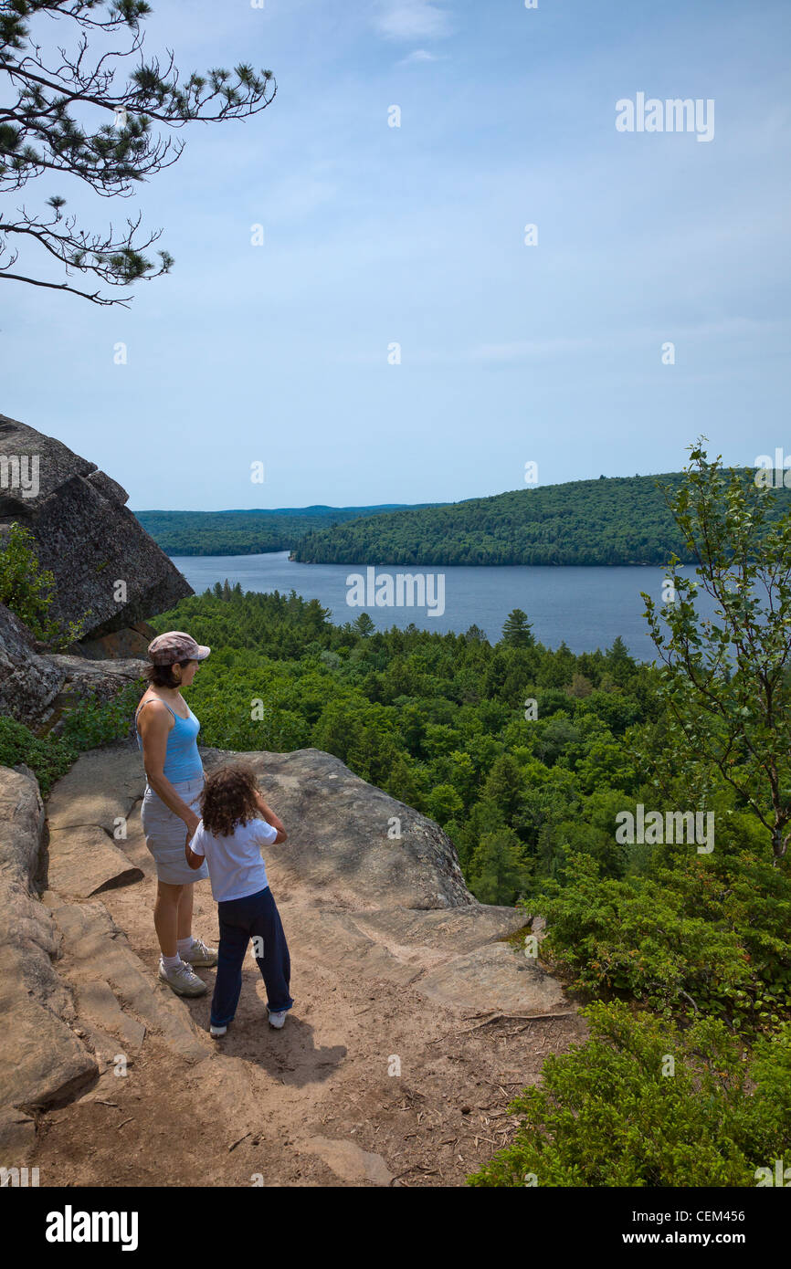 Adult and child lookout in Algonquin Park Stock Photo - Alamy