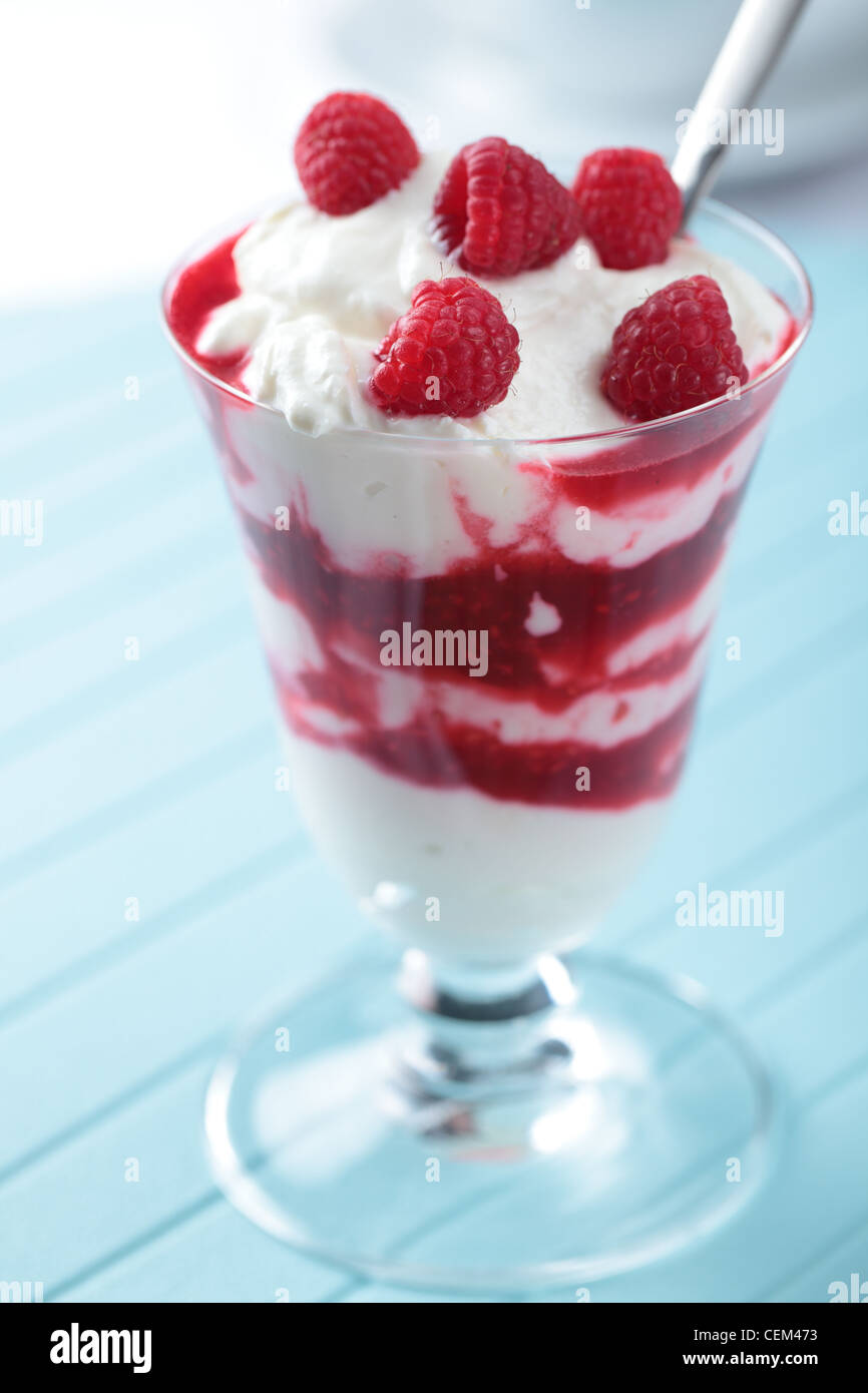 Raspberry parfait in a glass closeup Stock Photo - Alamy