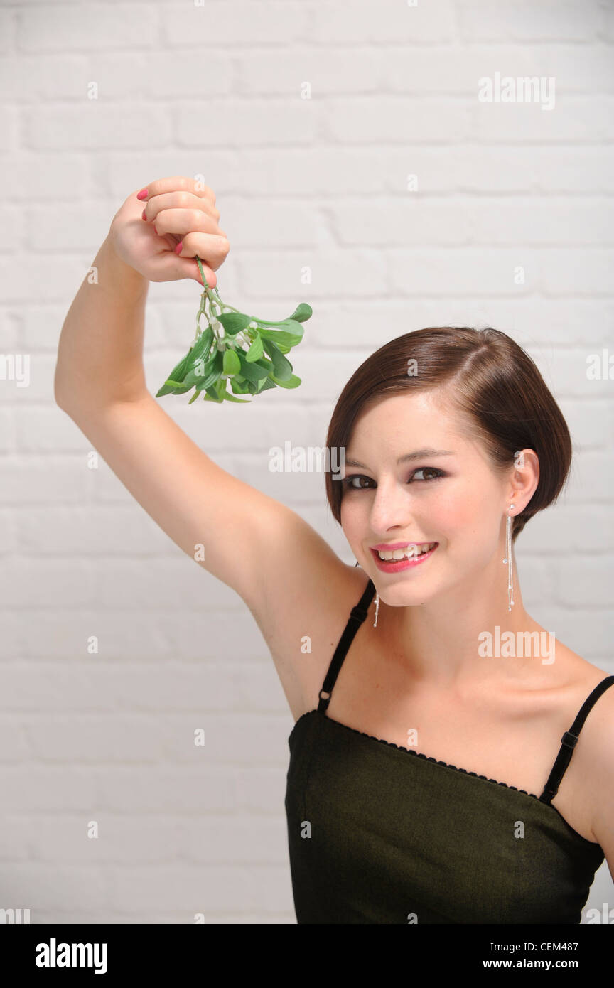 Female short brunette hair, wearing a black dress and silver drop ...