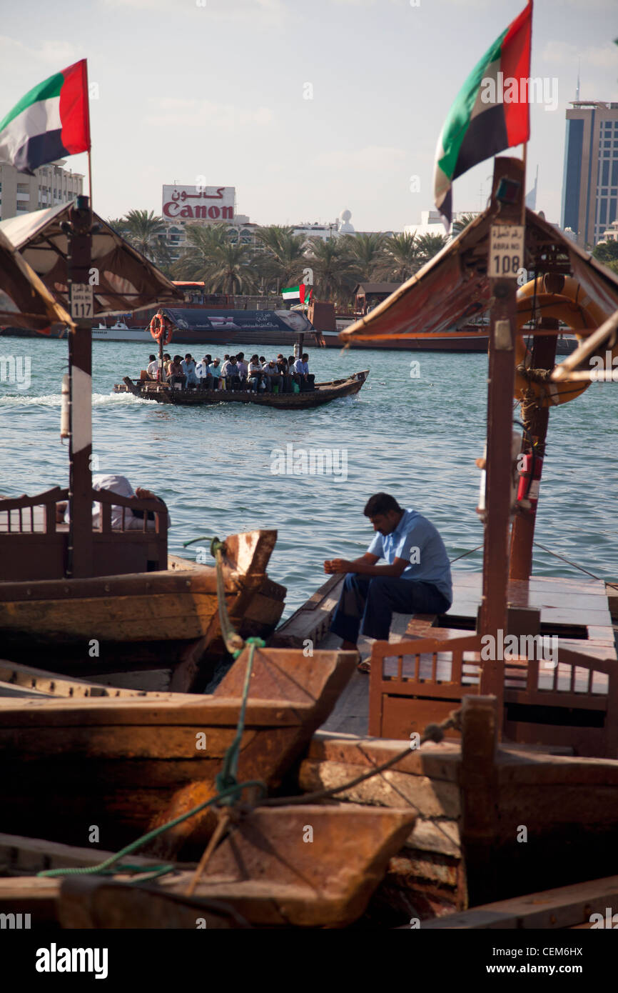 Abra along Dubai creek with commuters, Dubai, United Arab Emirates ...