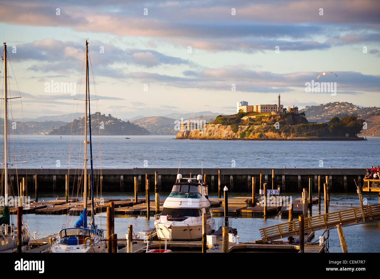 The setting sun lights up Alcatraz viewed from Pier 39 at the Fisherman ...