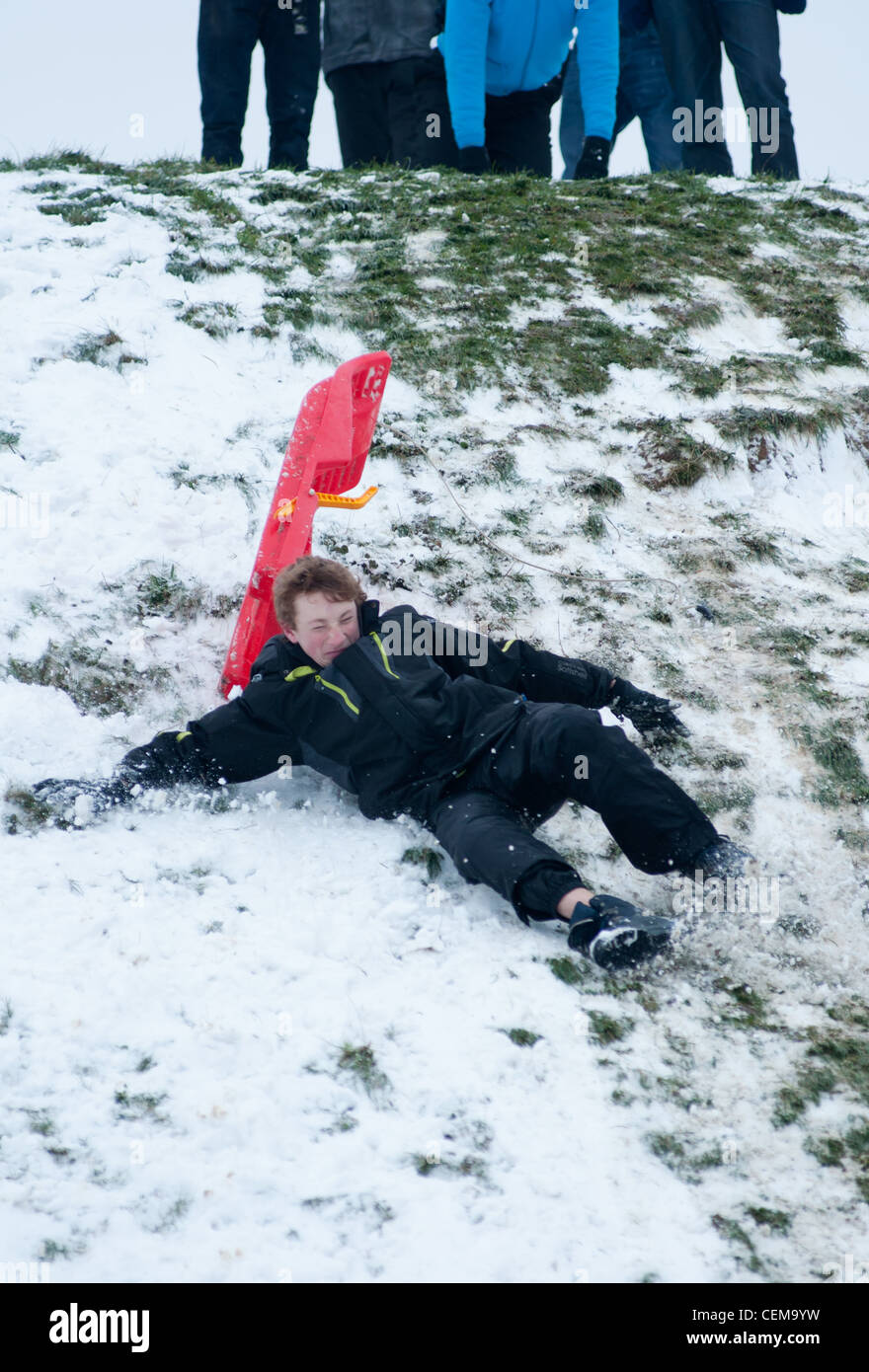 A boy falling during sledging on a hill in Cambridge, England. 2012 ...