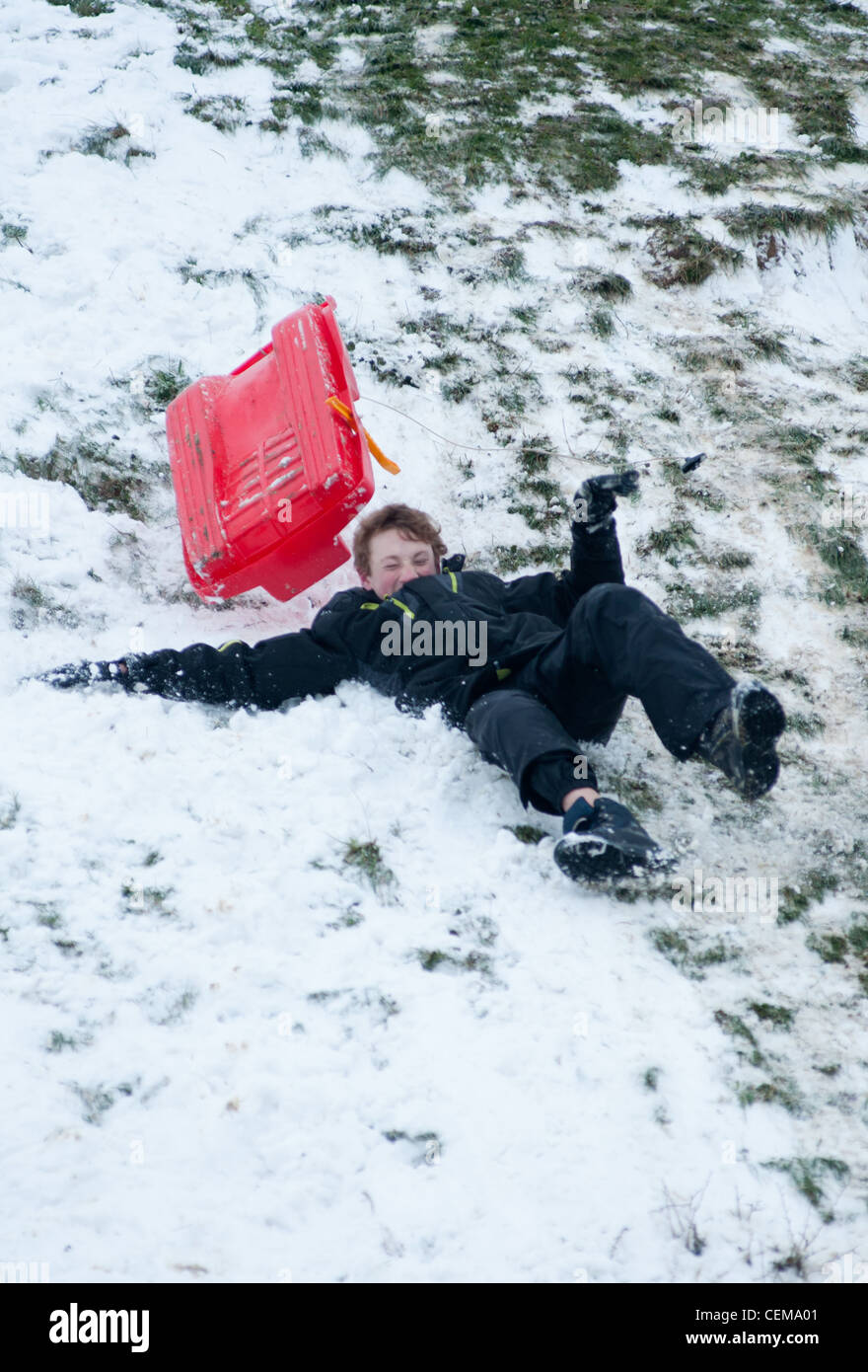 A boy falling during sledging on a hill in Cambridge, England. 2012 ...