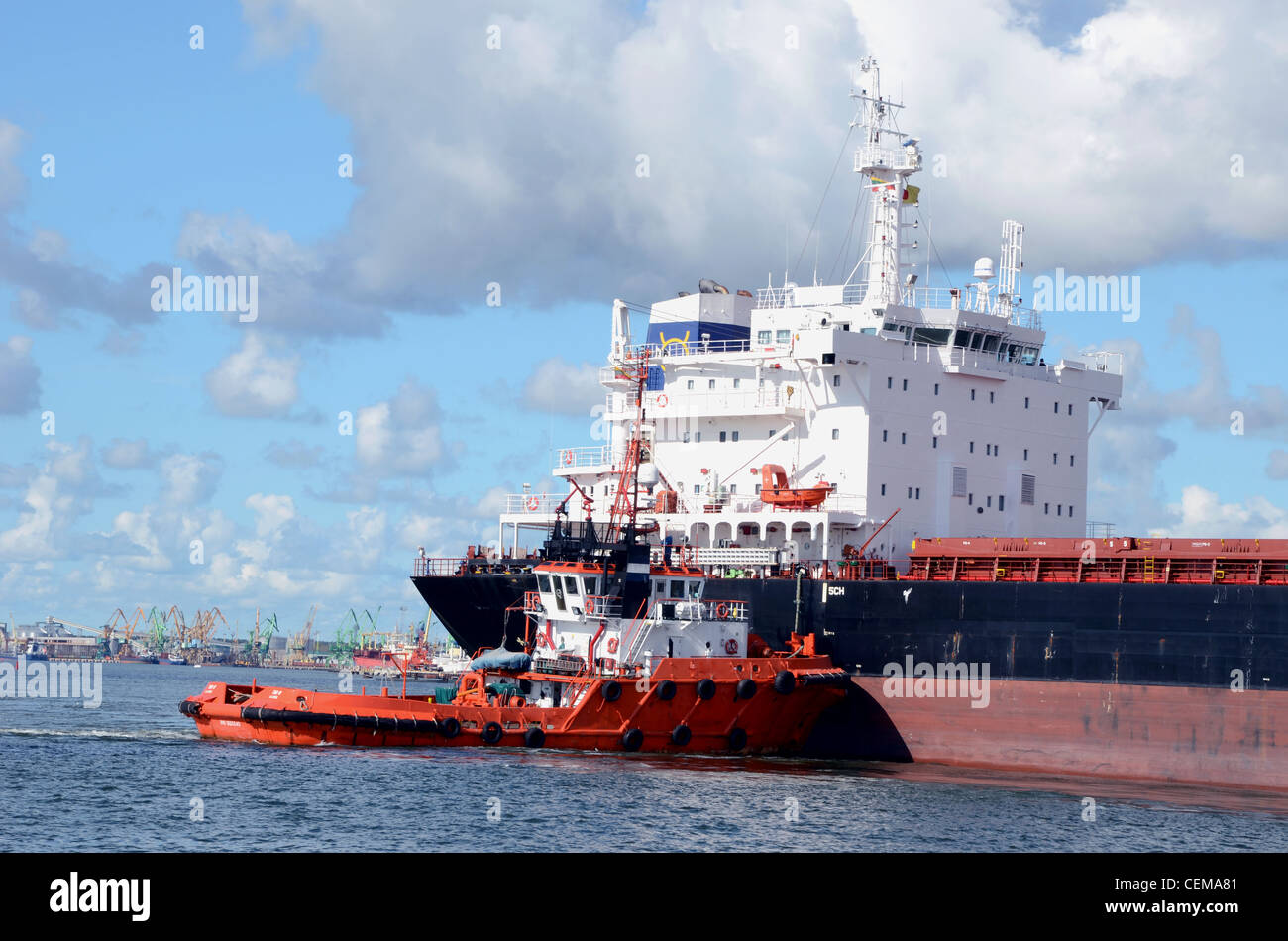 Industrial commercial cargo ships and cranes at sea port Stock Photo ...