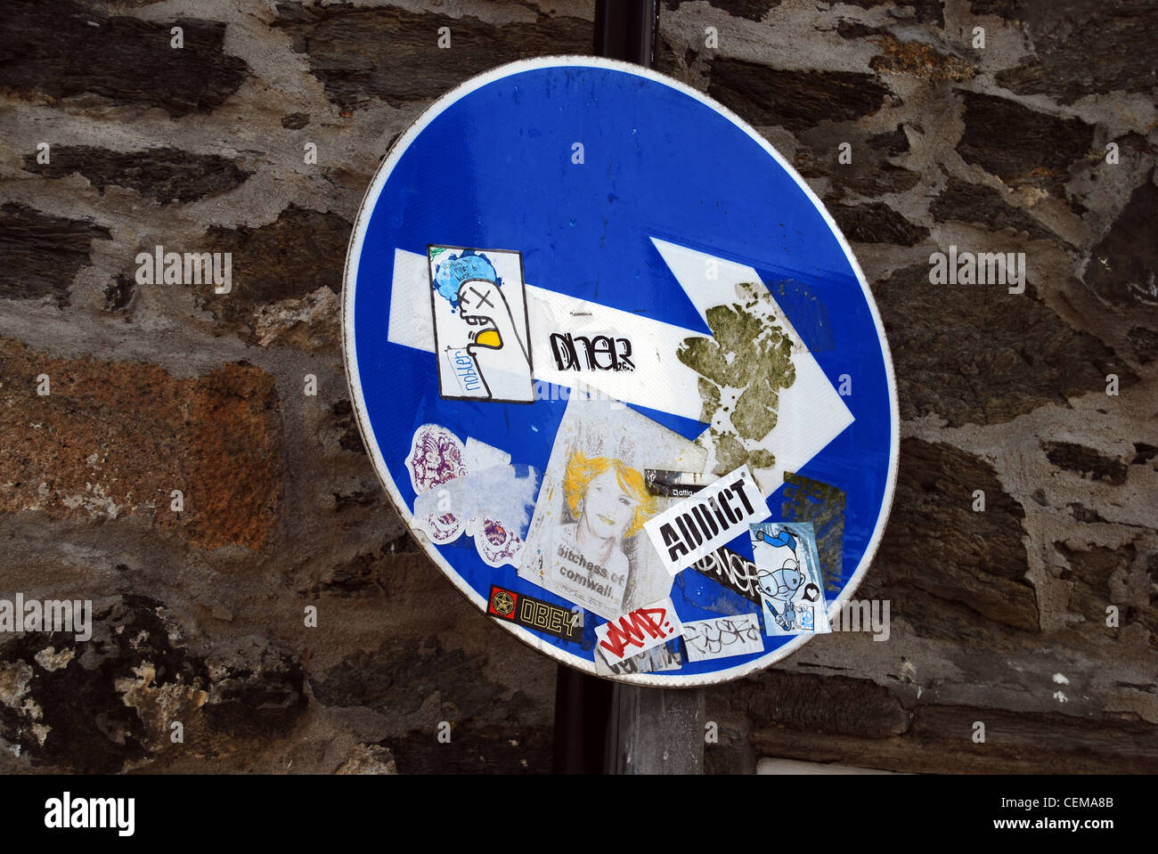 One way sign vandalsised number 3017 Stock Photo - Alamy