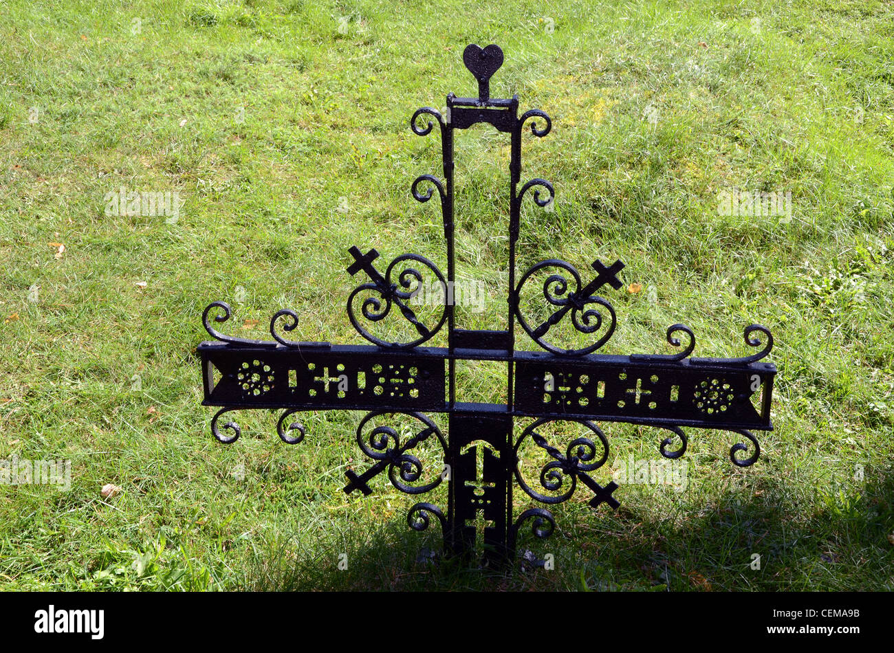Metal decorative cross in meadow. Old Partisan cemetery Stock Photo - Alamy