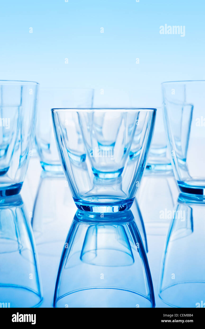arranged row of glasses with reflection Stock Photo - Alamy