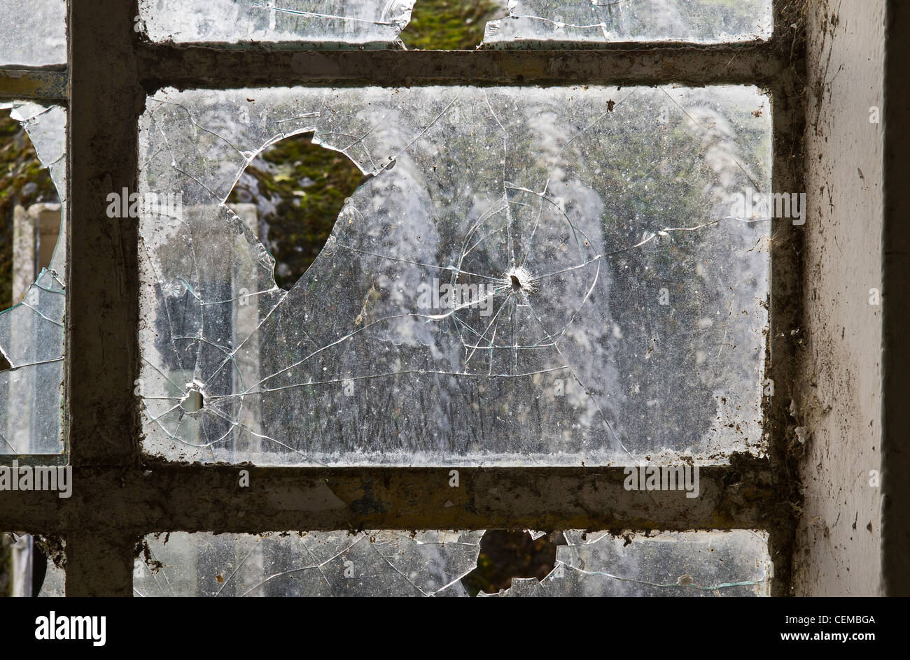 Broken and dirty window in a derelict factory Stock Photo - Alamy