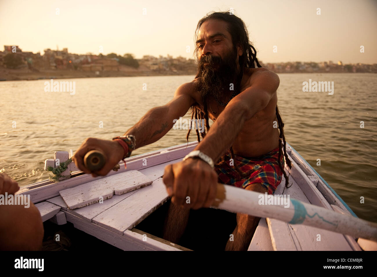 A Sadhu from the Himalayas rowing at Ganges River Stock Photo - Alamy