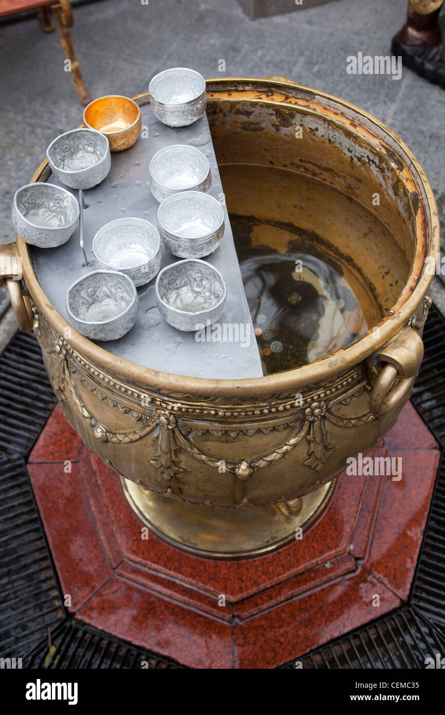 Holy water stoup at The Erawan Shrine Bangkok Stock Photo - Alamy