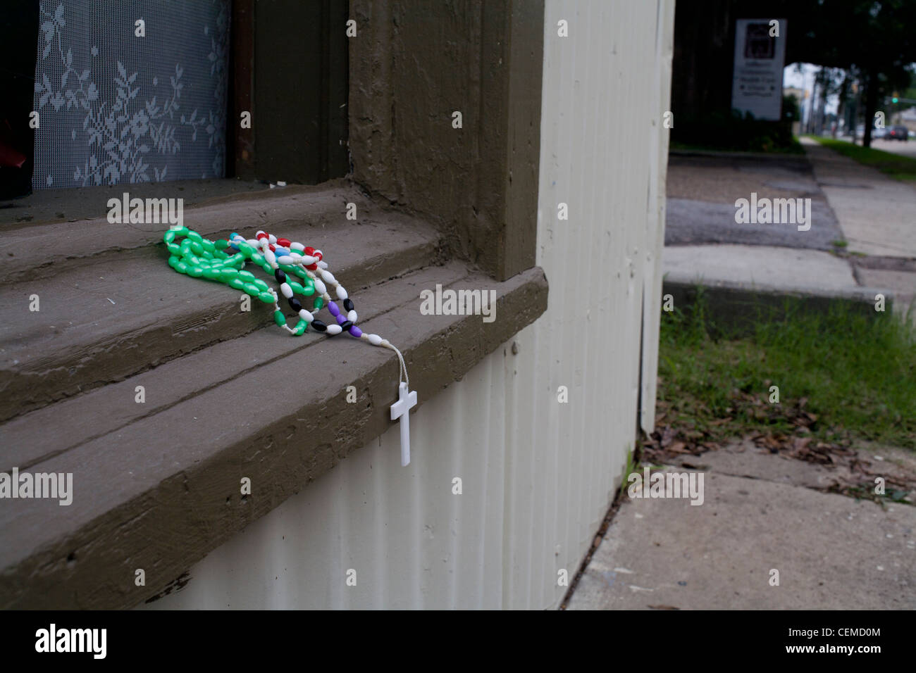 A colorful plastic rosary with crucifix on a window ledge Stock Photo ...